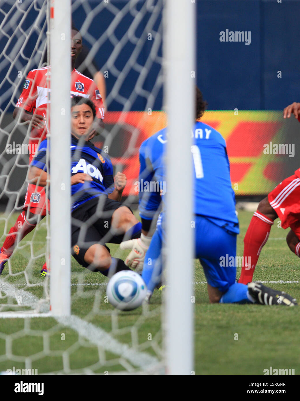 Manchester United defender, Rafael da Silva (L), watches as his shot ...