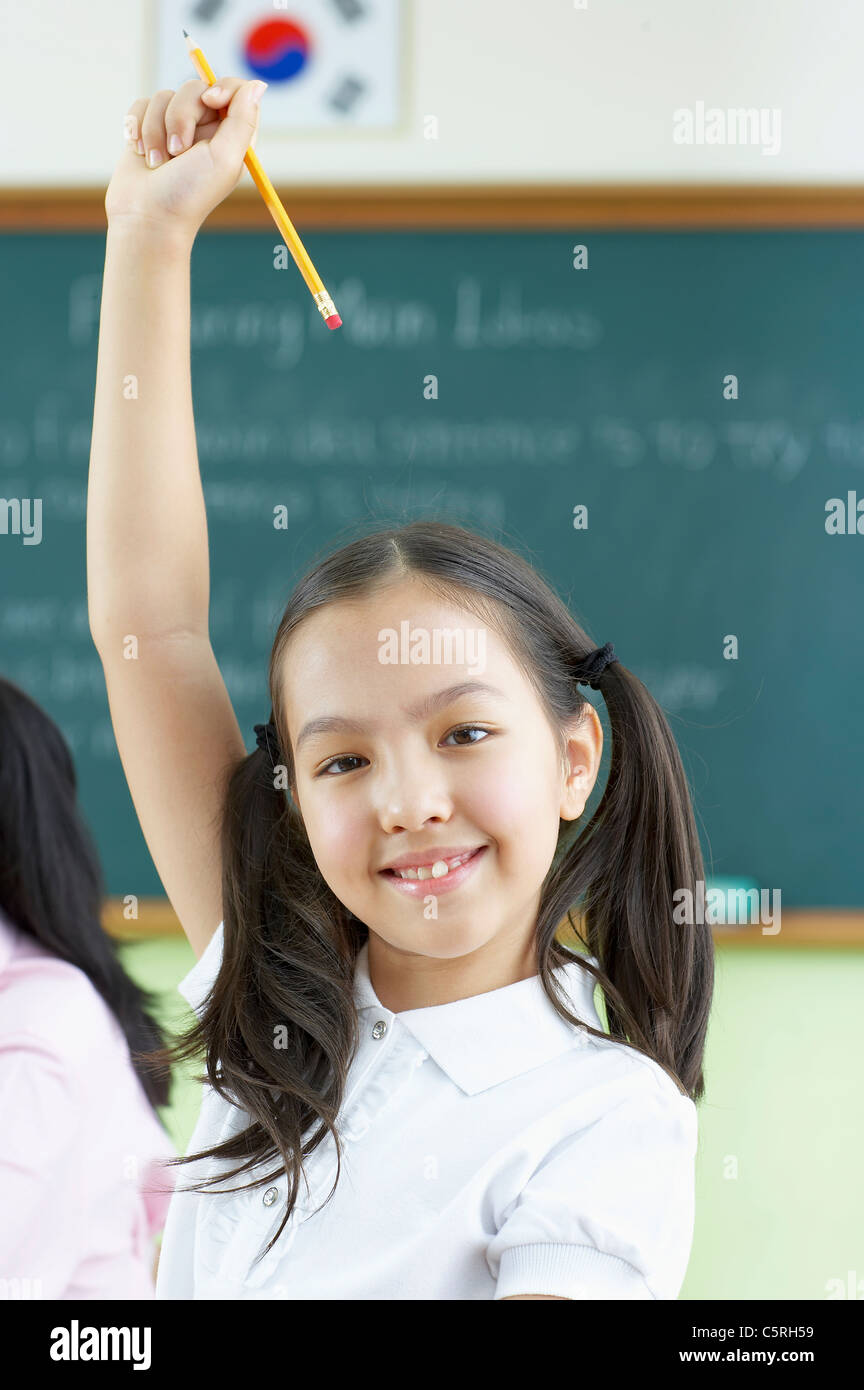An asian girl raising hand Stock Photo - Alamy