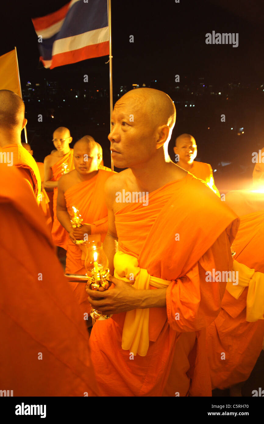 Thai monks holding candles on Buddhist Lent ceremony in Bangkok Stock ...