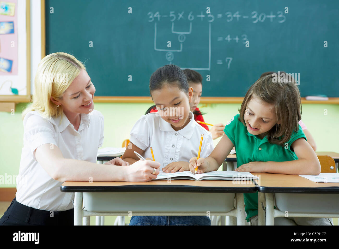 Boy helping girl math hi-res stock photography and images - Alamy