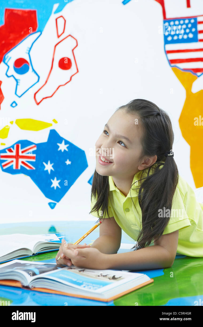 A girl studying on the floor Stock Photo - Alamy