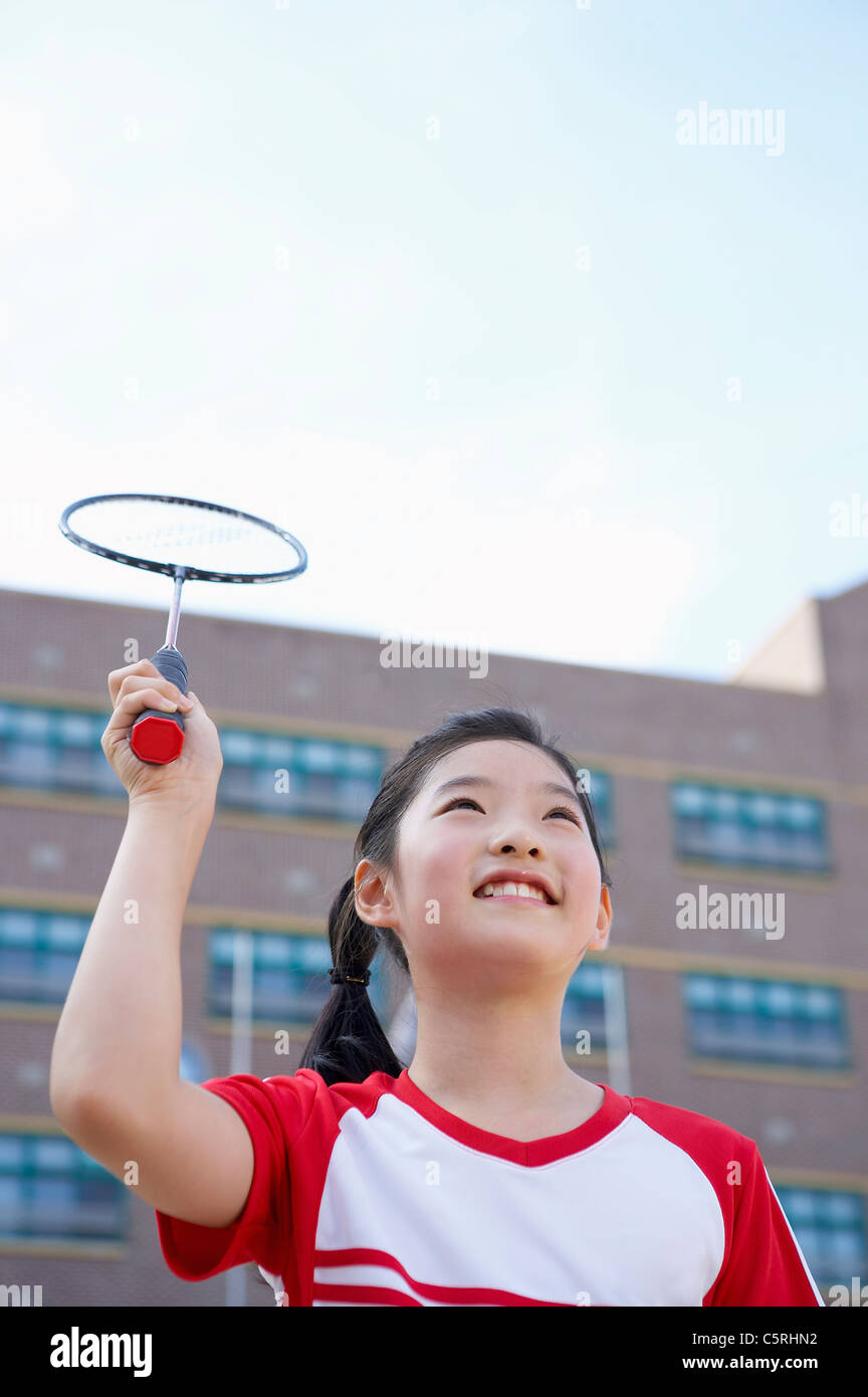 An Asian girl holding a racket Stock Photo - Alamy