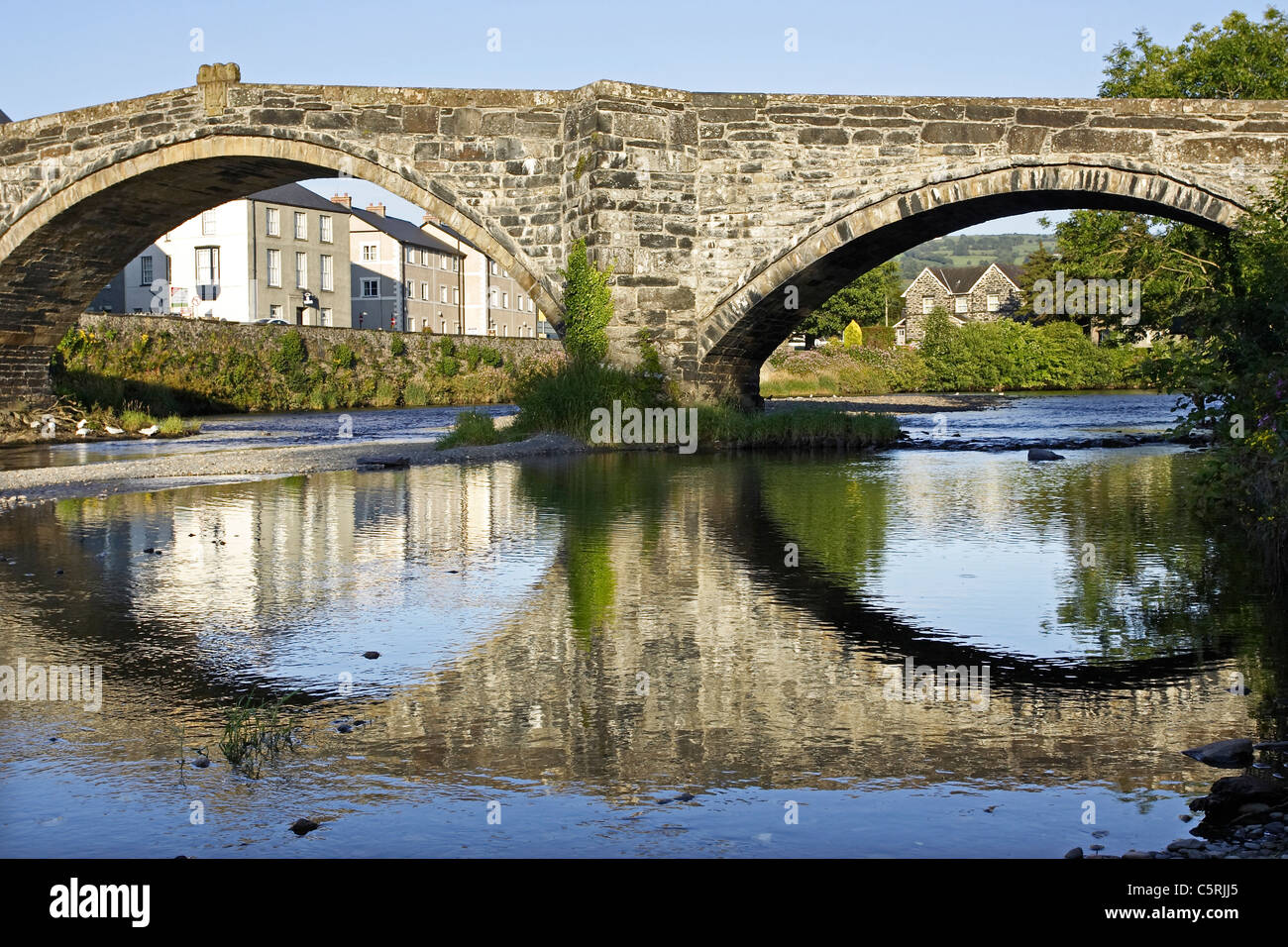 A view of the stone bridge across the River Conwy at Llanrwst in North ...