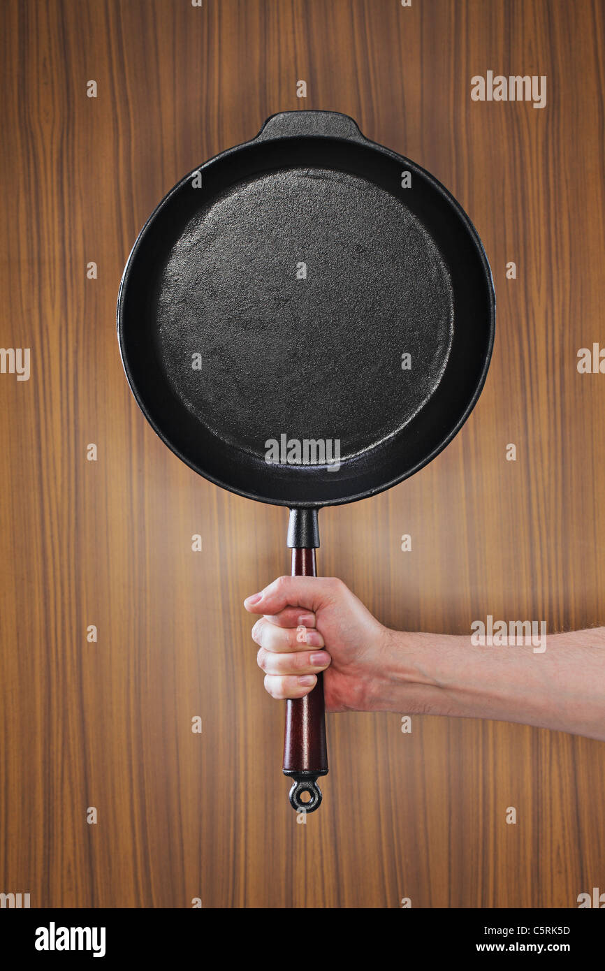 An old-fashioned cast iron frying pan Stock Photo - Alamy