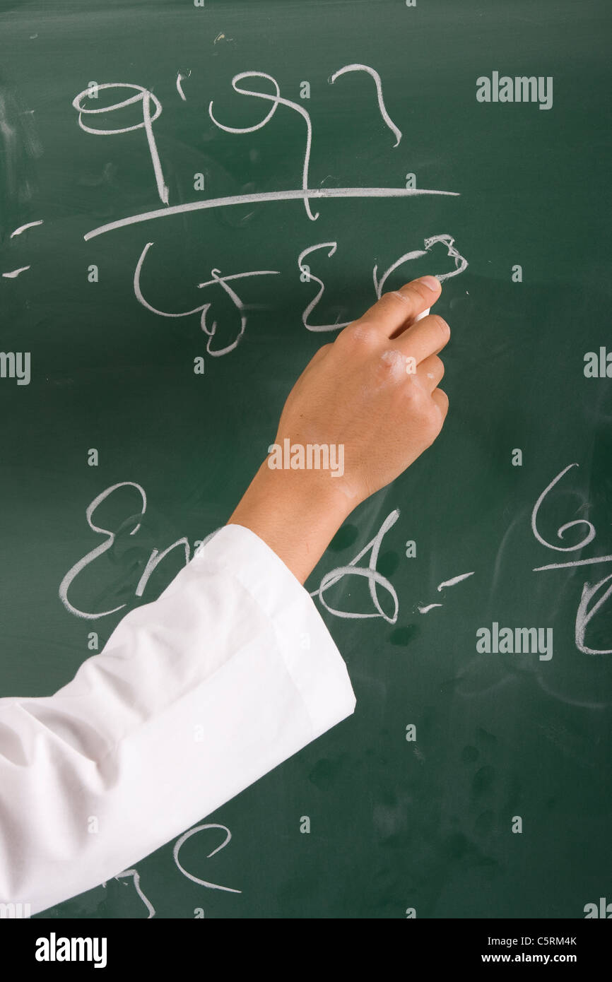 Teacher Writing On Blank Chalkboard Stock Photos & Teacher Writing On ...