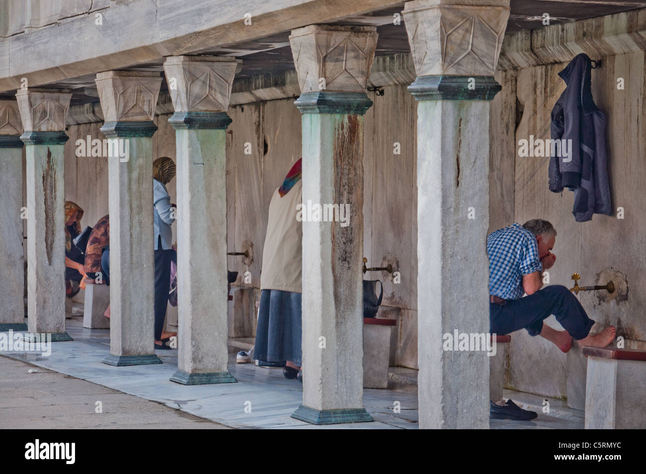 Muslims washing their feet before entering the mosque, The Blue Mosque ...
