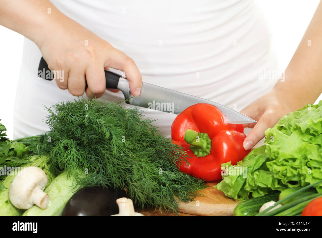 Woman's hands cutting vegetablesat the kitchen Stock Photo - Alamy