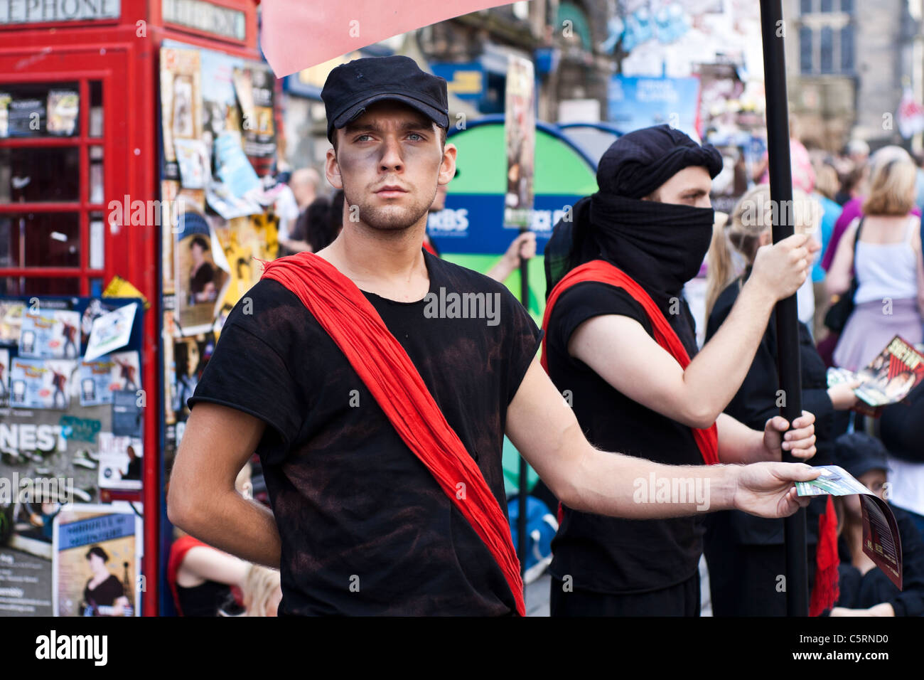 A man dressed as a guerrilla soldier standing on Edinburgh's Royal Mile ...