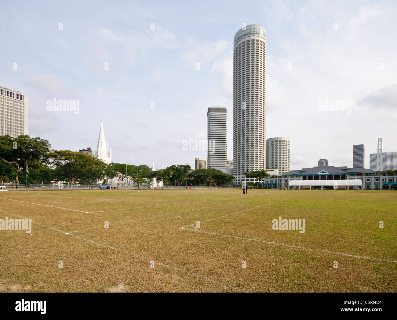 Playing field of Singapore Cricket Club, founded in 1852, in front of ...