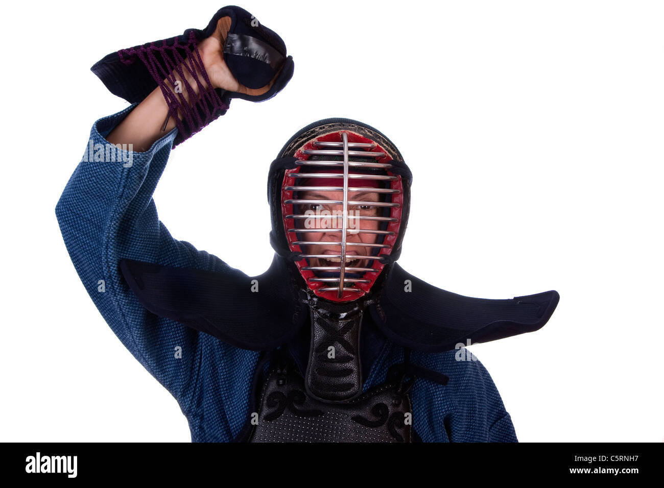 Woman in kendo uniform expressing victory Stock Photo - Alamy