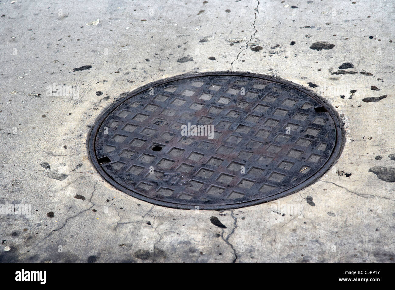 steam rising from metal manhole cover in the street Nashville Tennessee ...