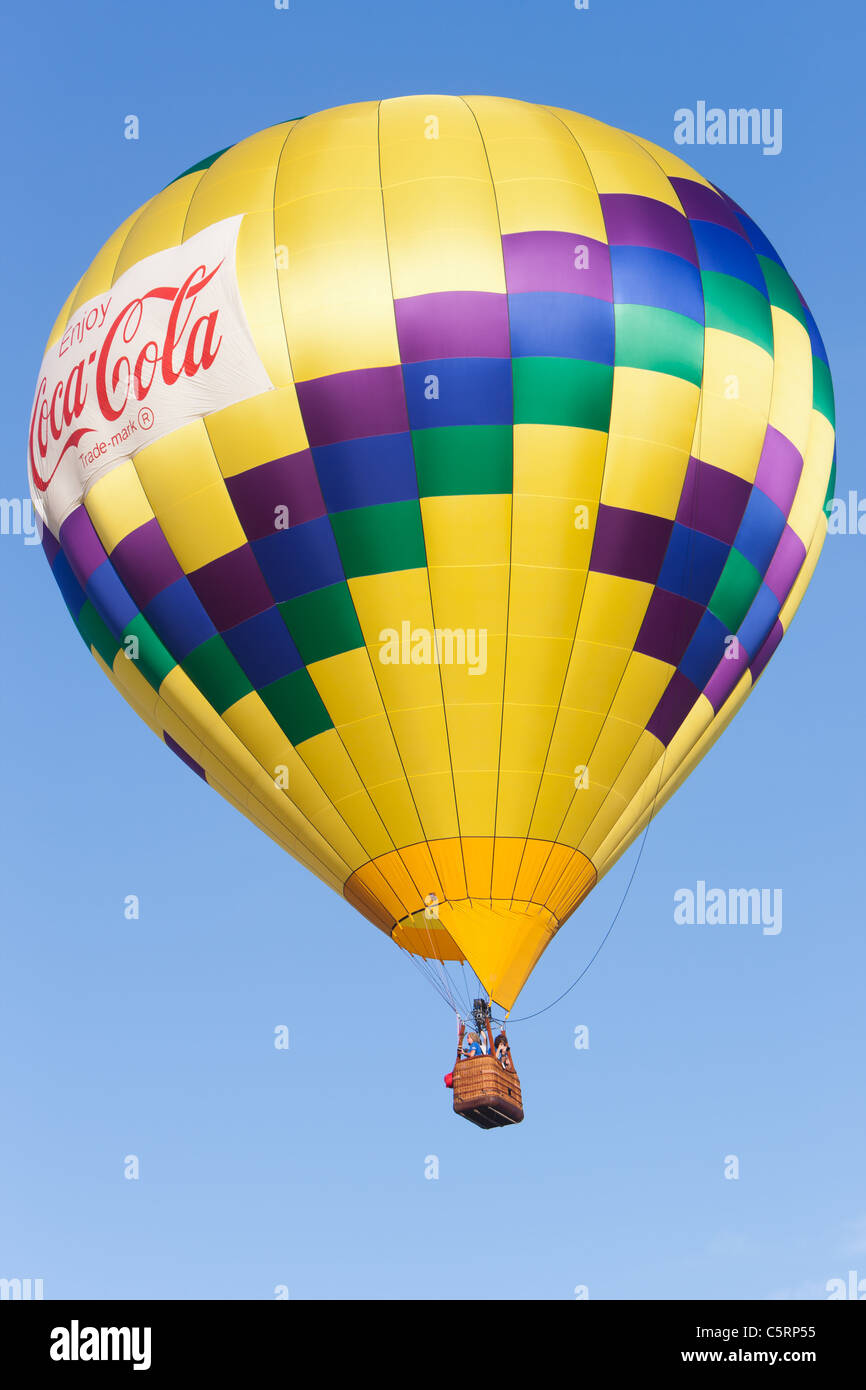 The Coca-Cola hot air balloon rises during a morning balloon ascension ...