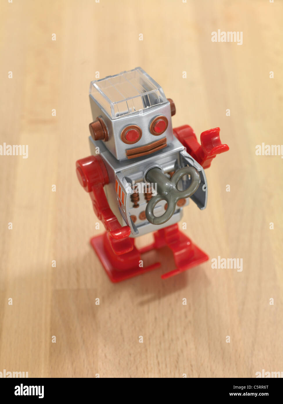 A robot walking on a wooden floor Stock Photo - Alamy