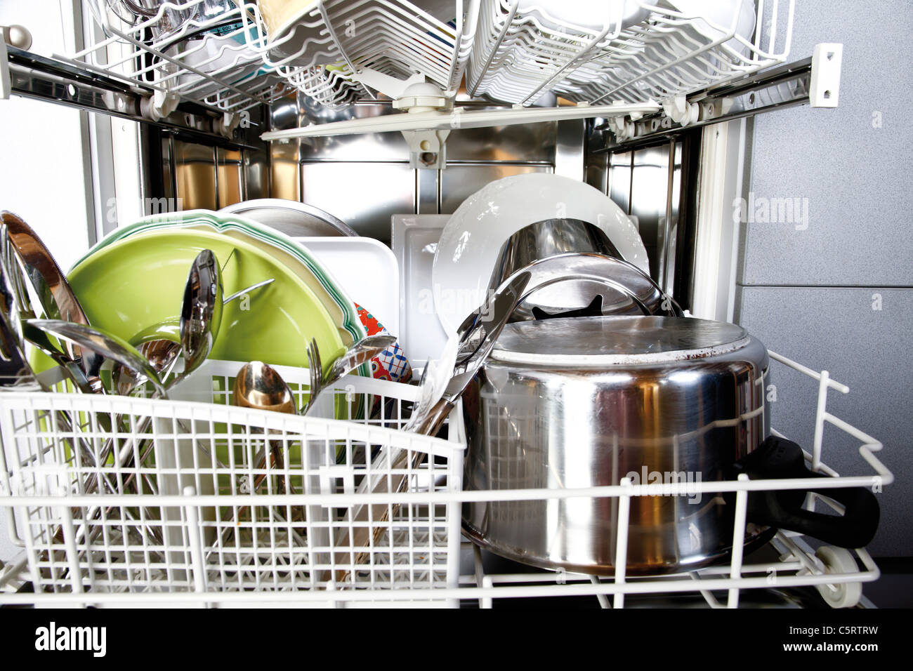 Cleaned dishes in open dishwasher, close-up Stock Photo - Alamy