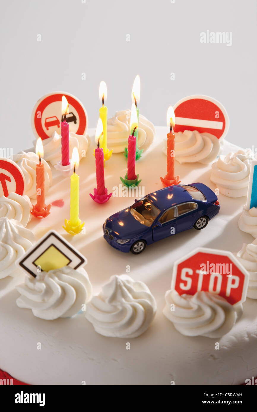 Fancy cake with road signs and toy car, elevated view Stock Photo - Alamy