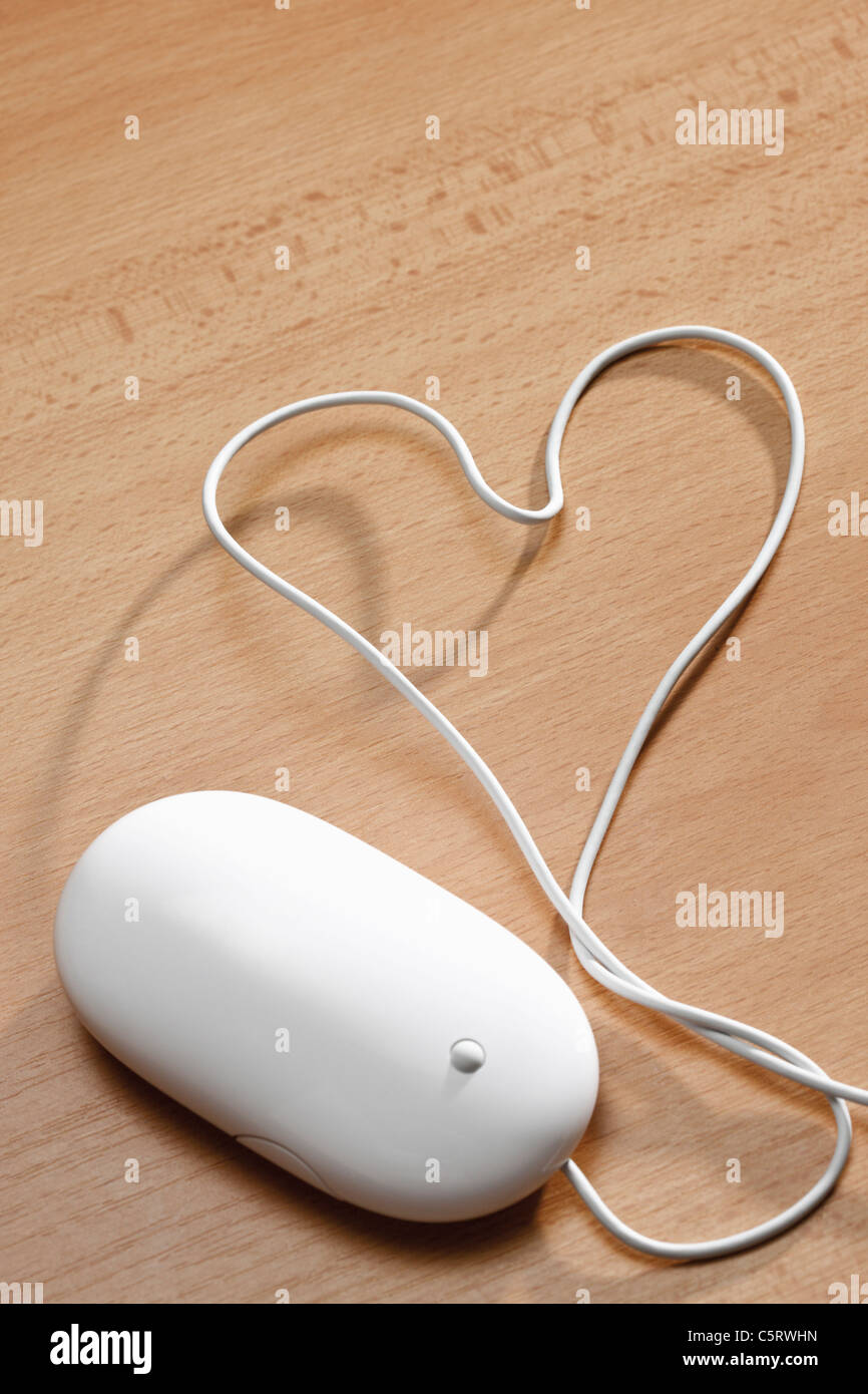 Computer mouse with heart-shaped wire, elevated view Stock Photo - Alamy