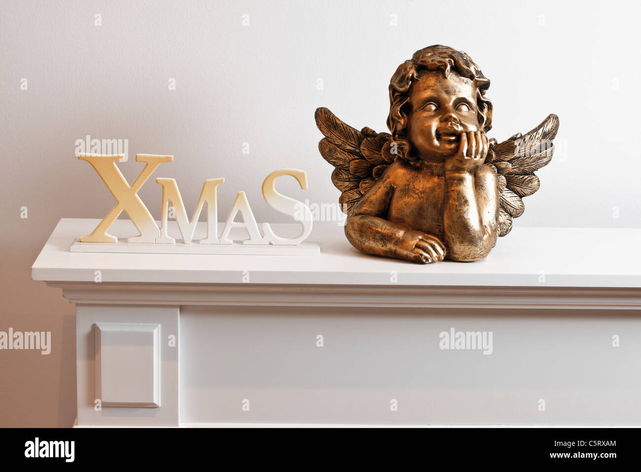 Angel figurine and decoration on shelf Stock Photo - Alamy
