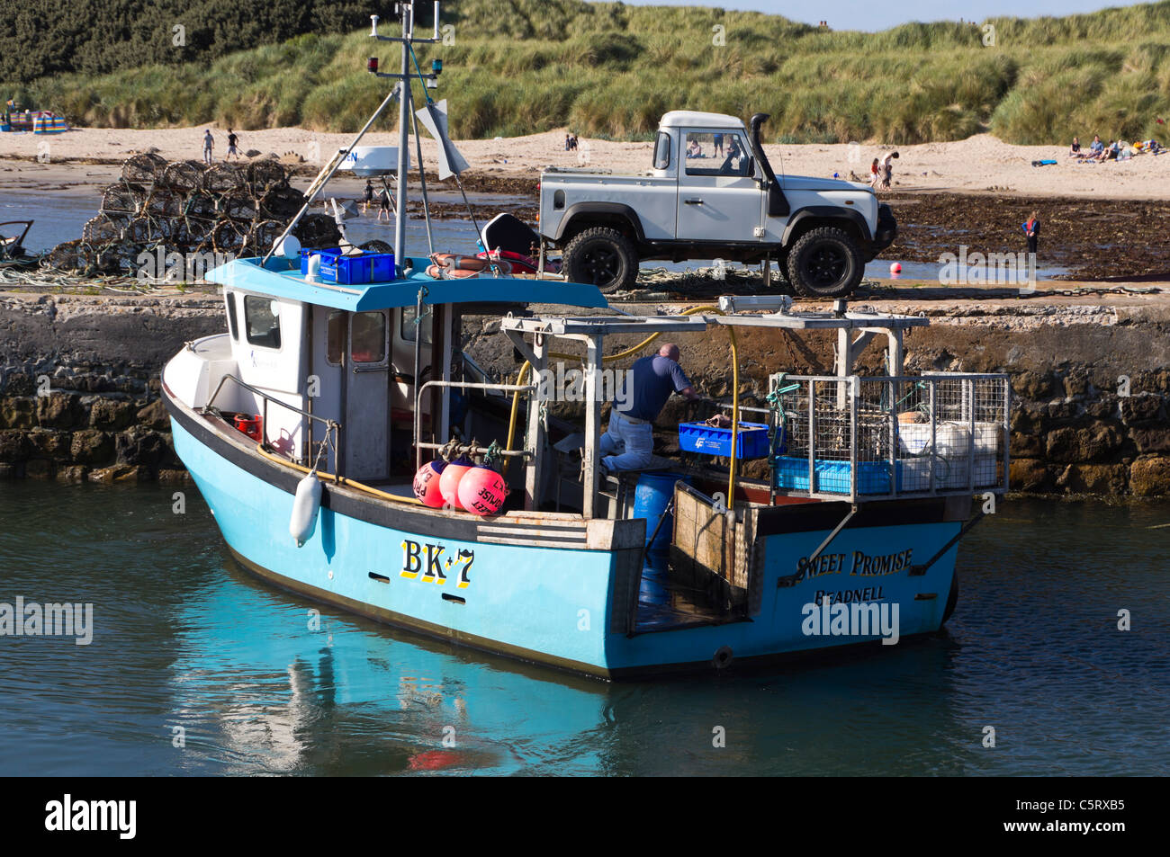 Returning with mackerel catch in the evening - small fishing boat at ...