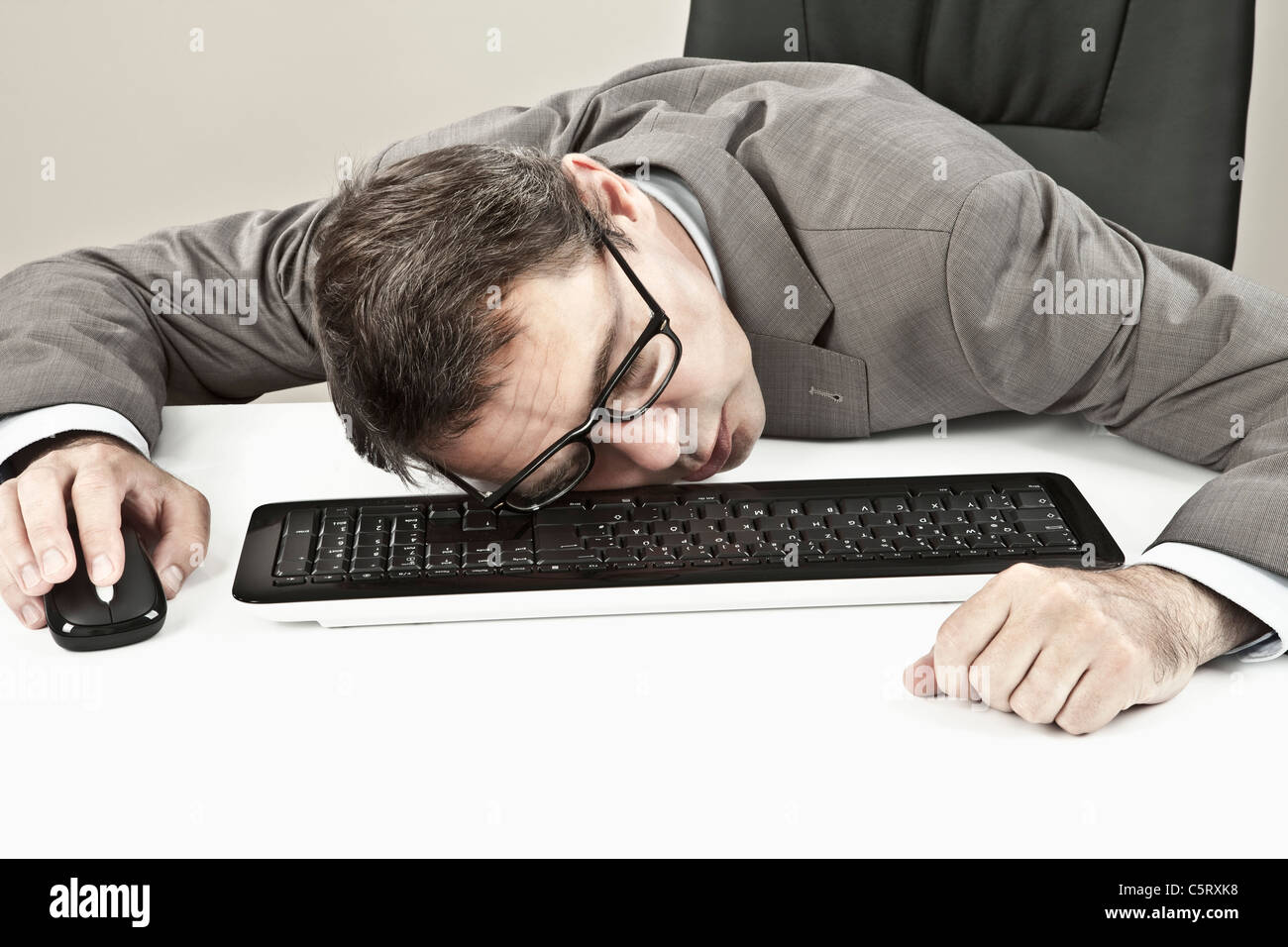 Employee resting head on keyboard hi-res stock photography and images ...