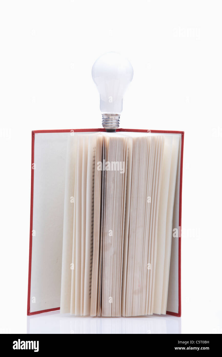 light bulb on the book Stock Photo - Alamy