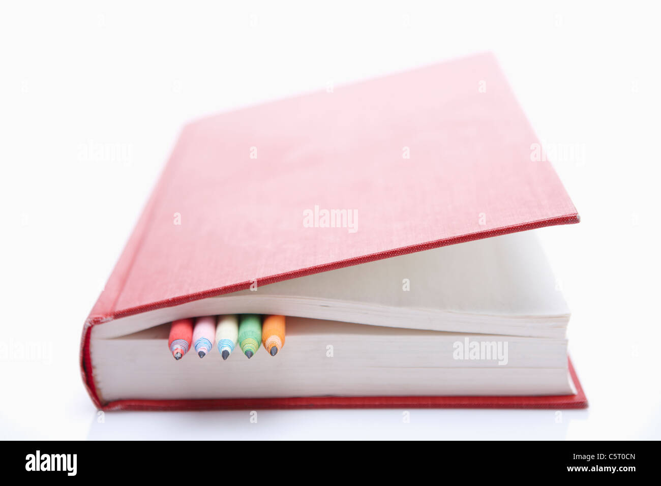 pencils in books Stock Photo - Alamy