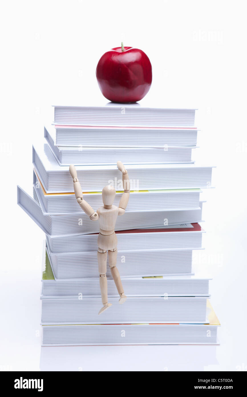 figurine going up the book Stock Photo - Alamy
