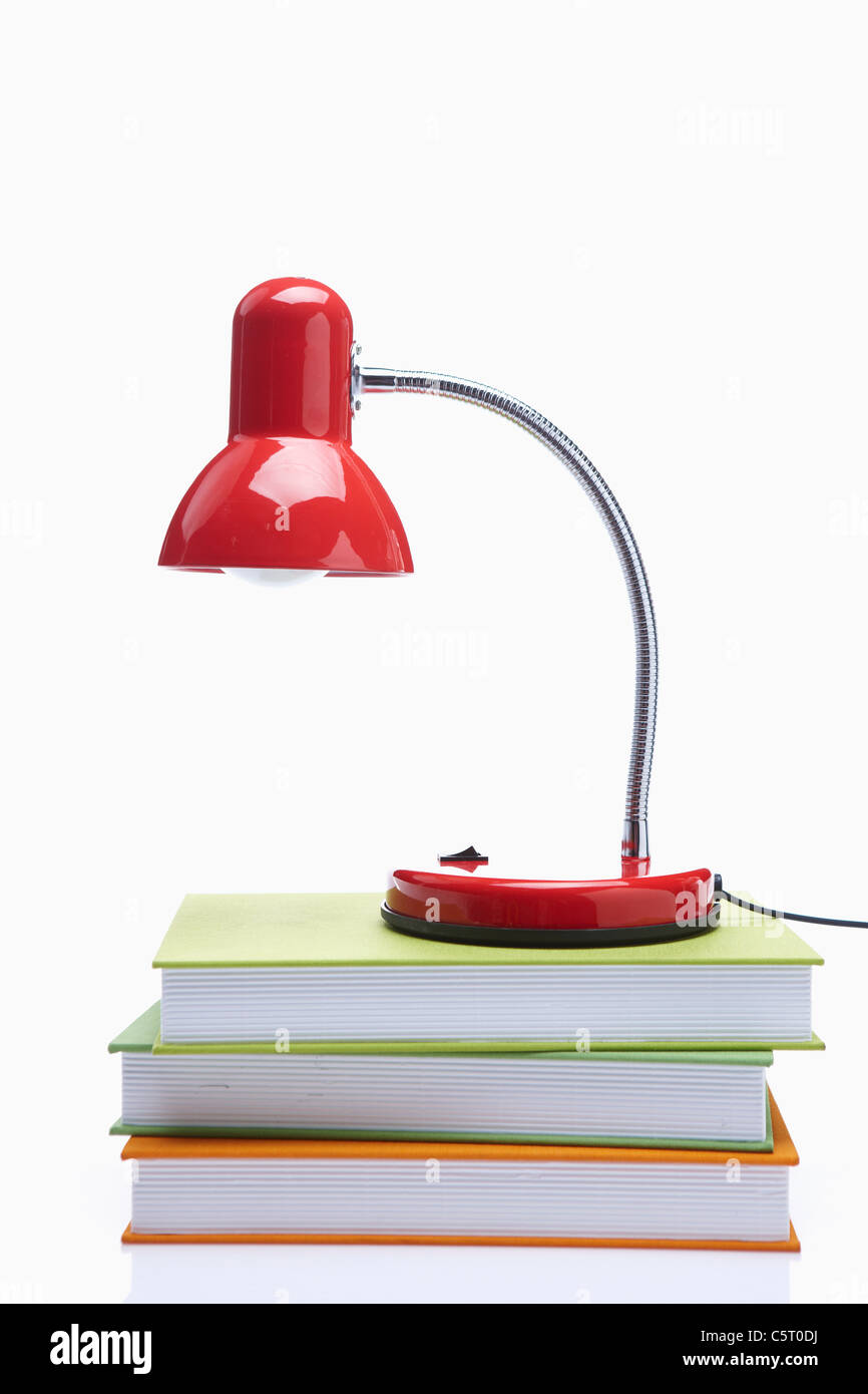 lamp and opened book Stock Photo - Alamy