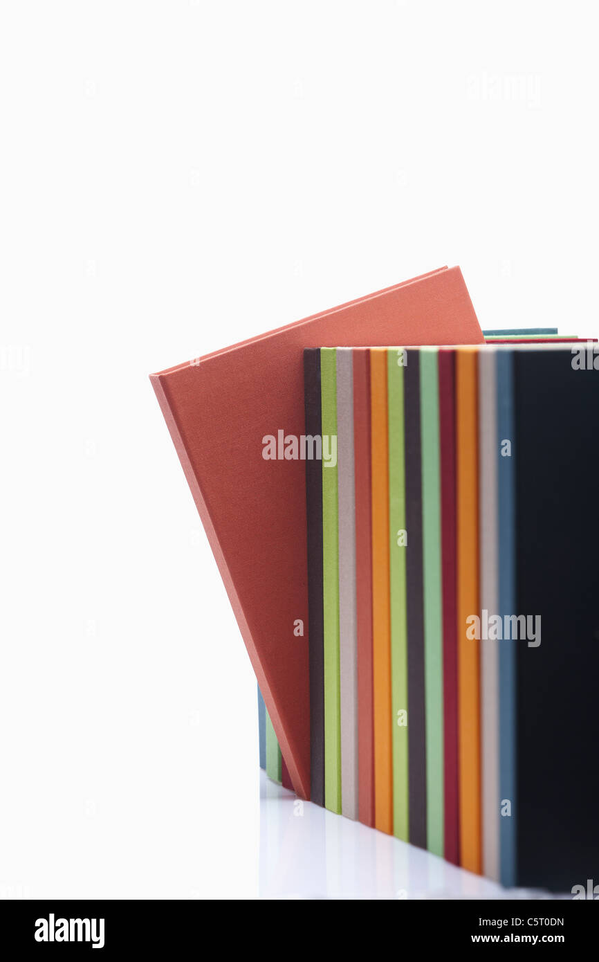 books arranged but one stood up Stock Photo - Alamy