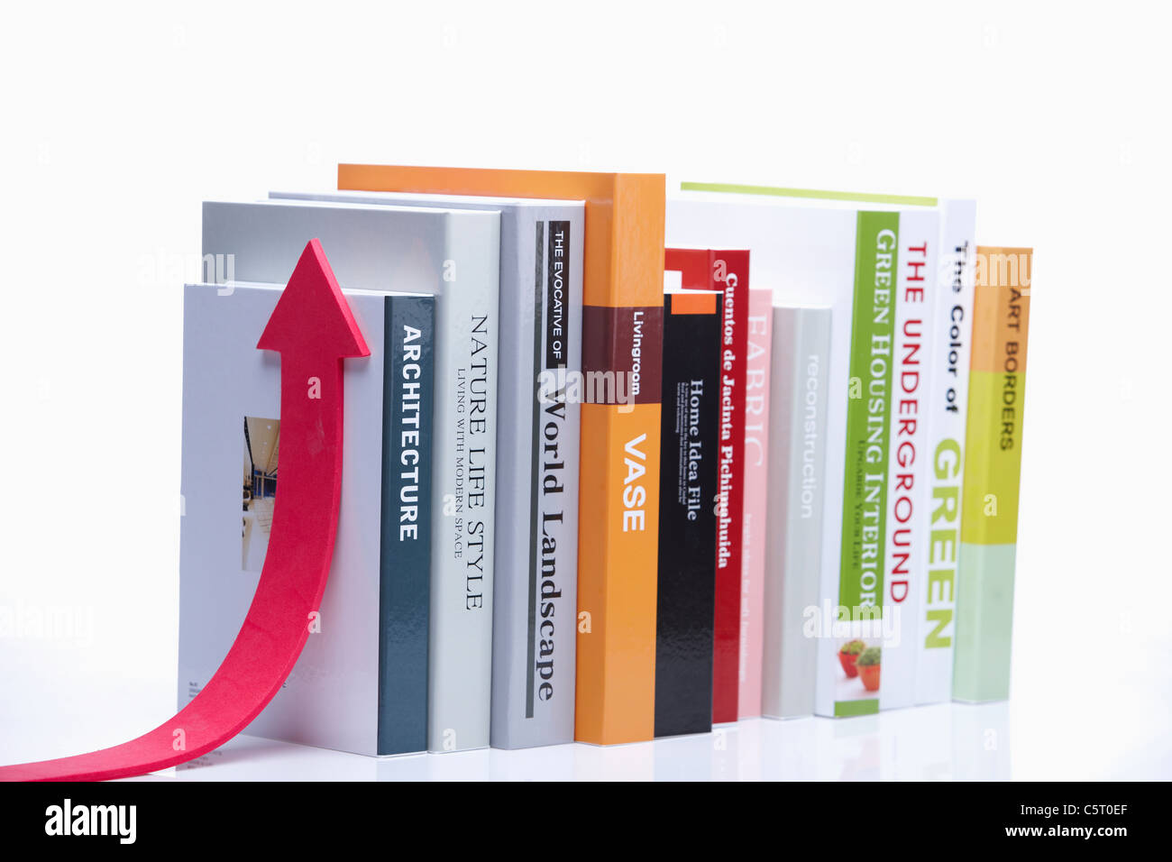 arrow sign with books Stock Photo - Alamy