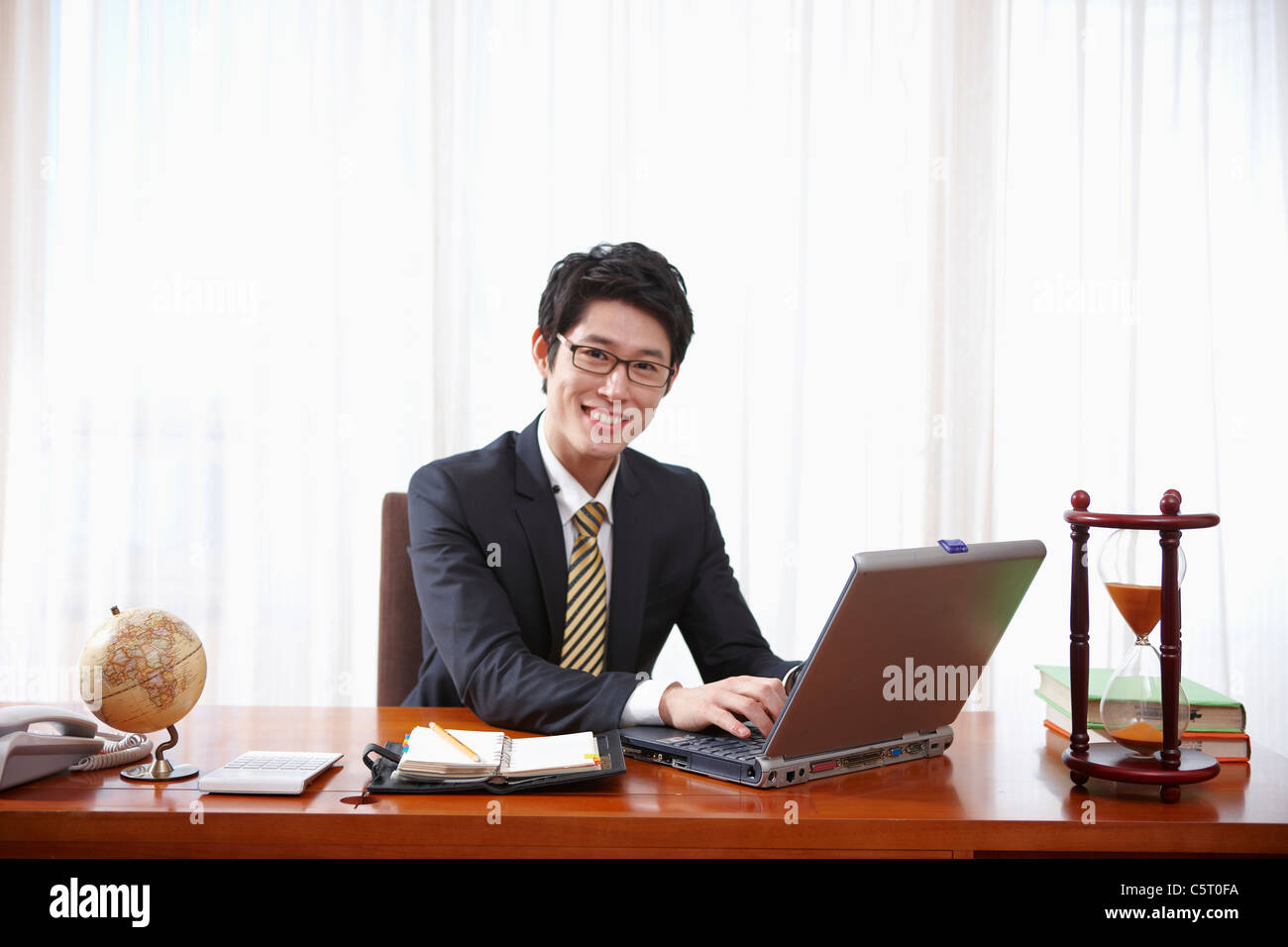 man doing his work on the desk Stock Photo - Alamy