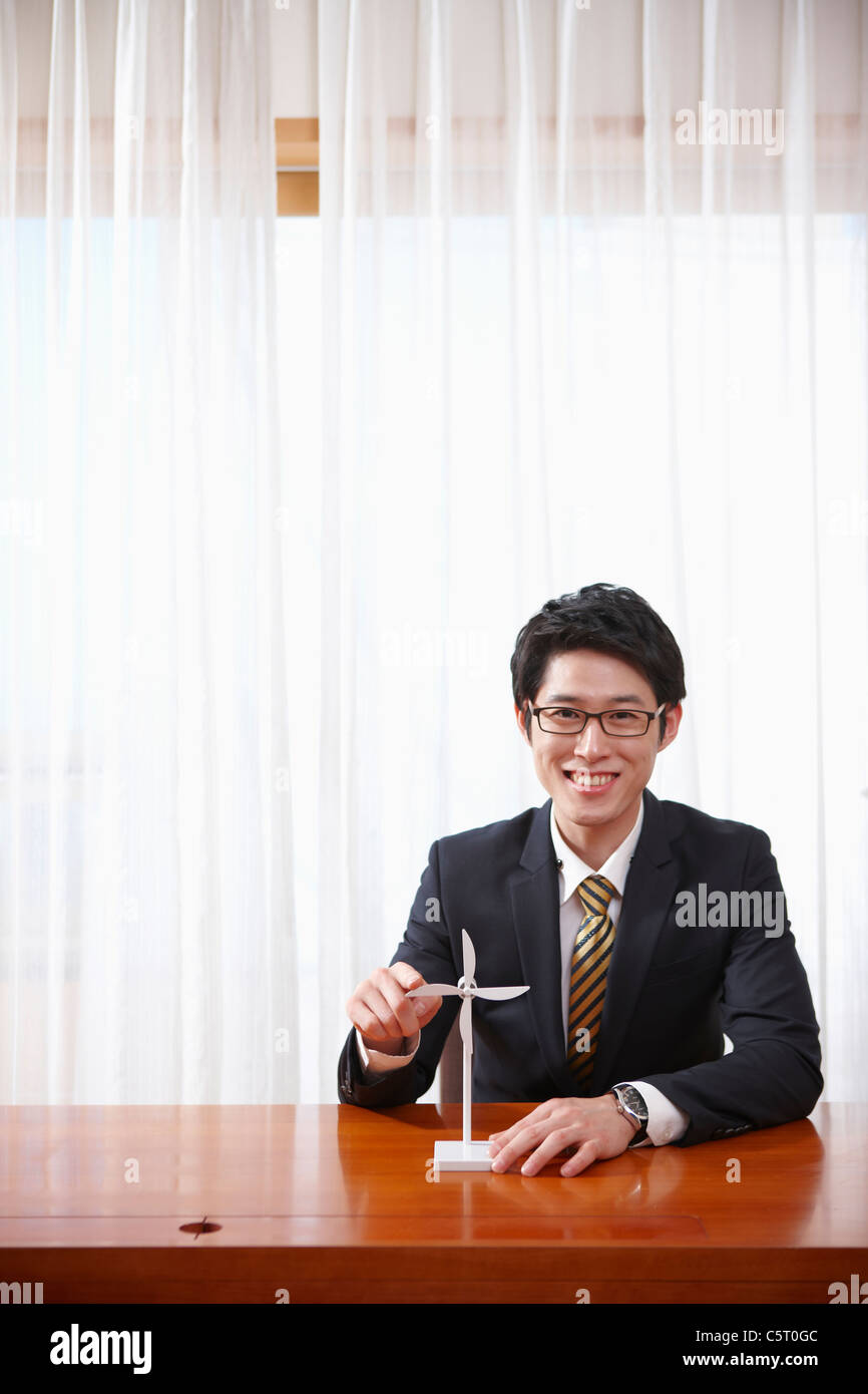 man touching pin wheels Stock Photo - Alamy