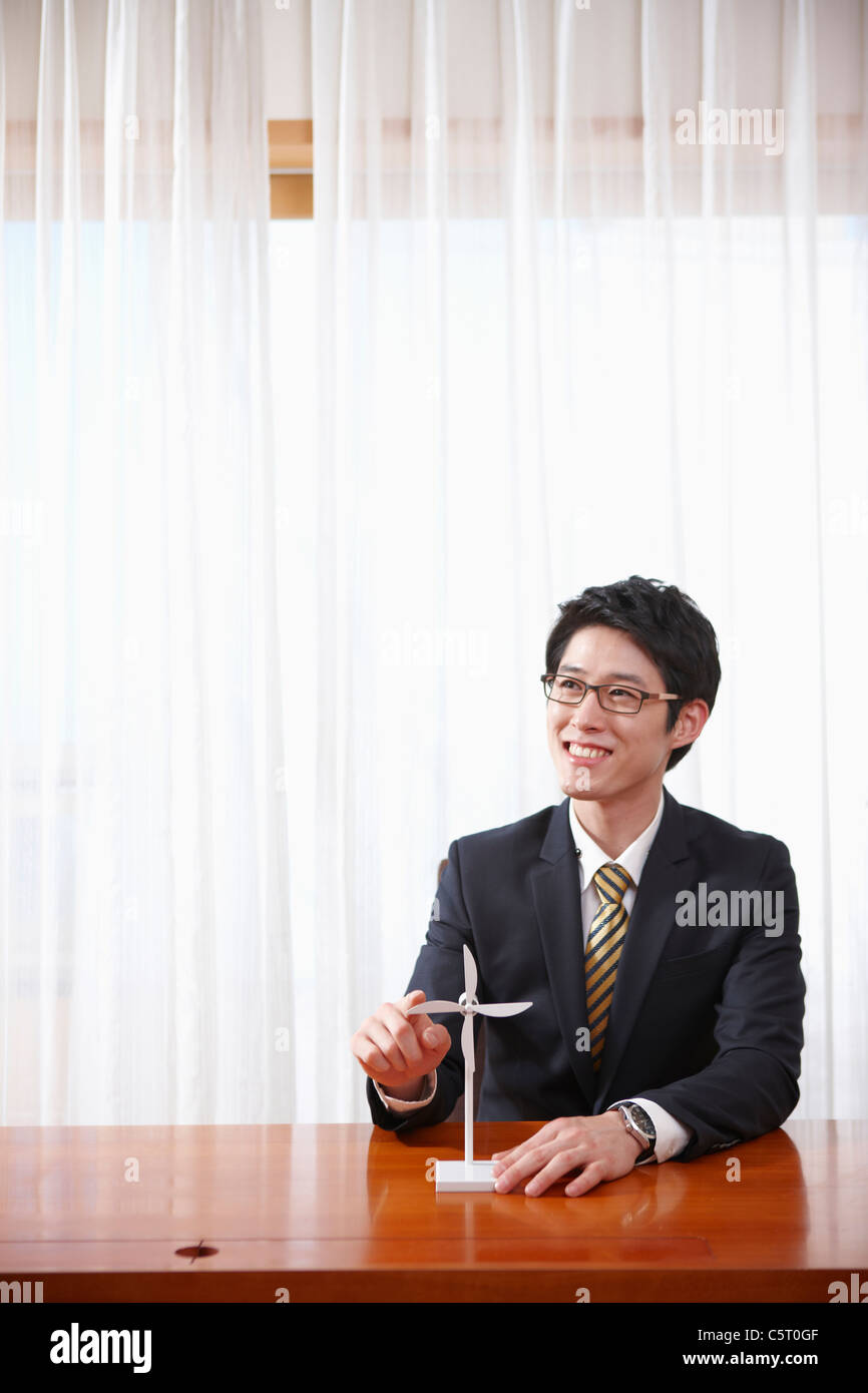 man touching pin wheels Stock Photo - Alamy