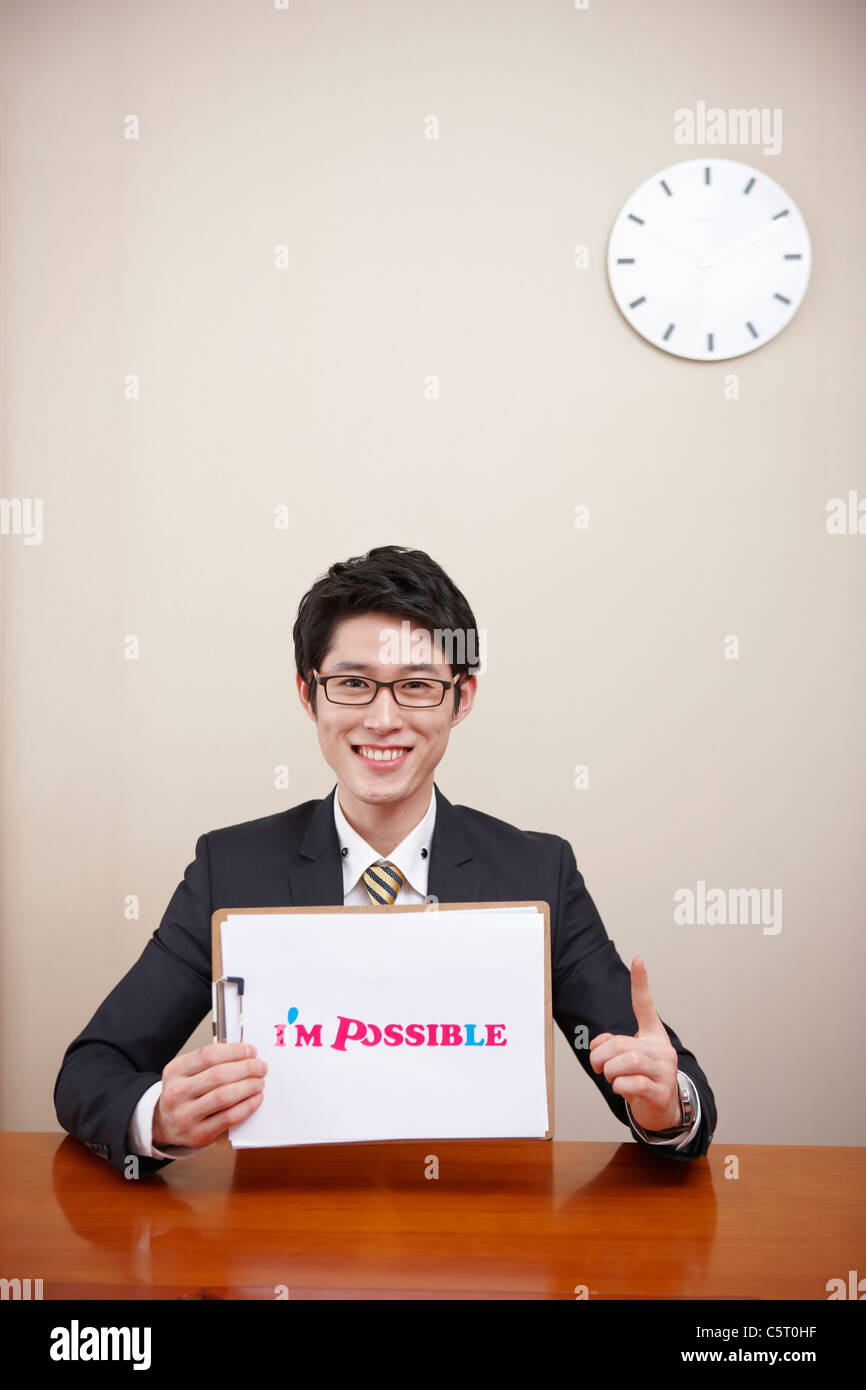 man holding message board Stock Photo - Alamy