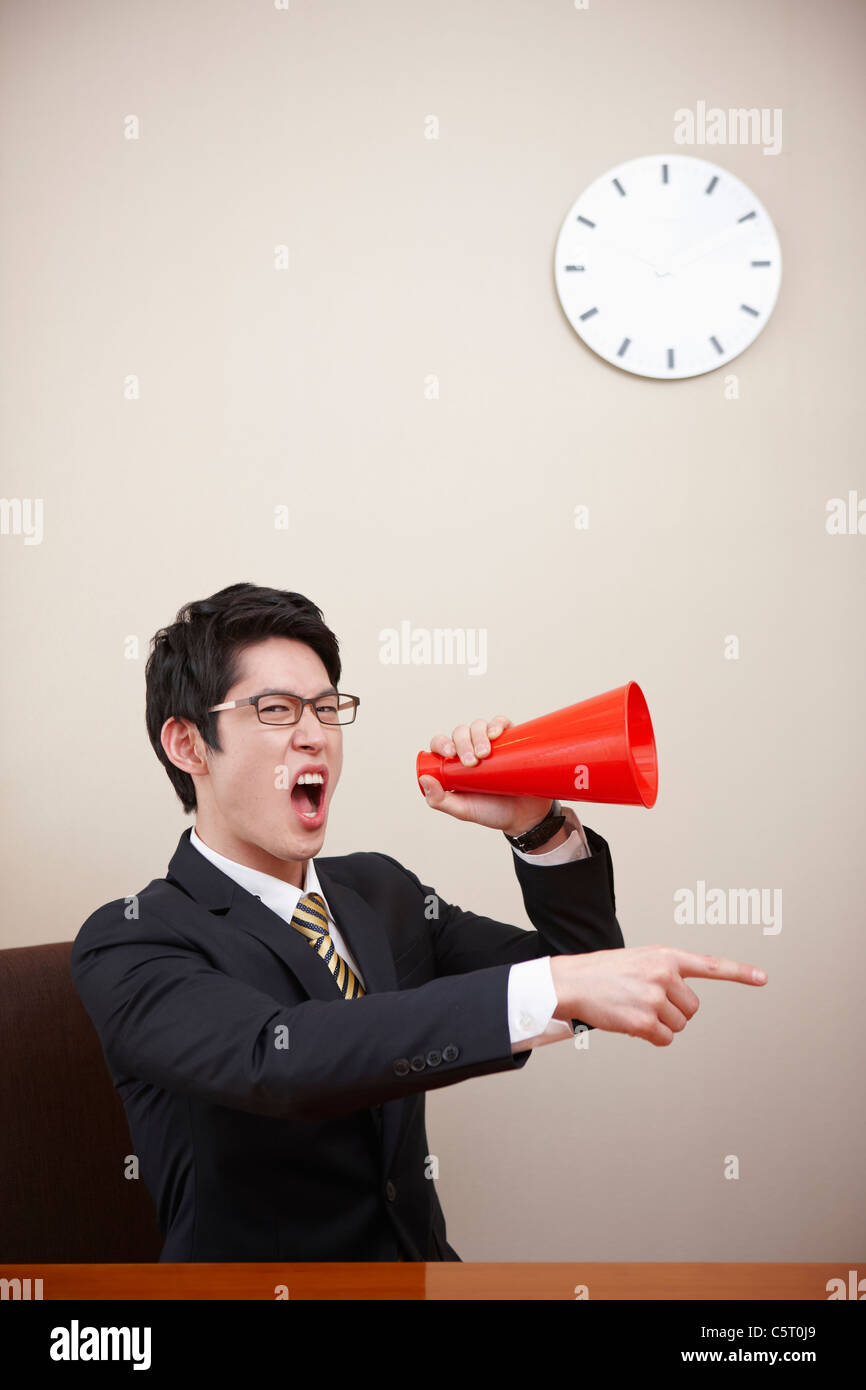 man is yelling with loud speaker Stock Photo - Alamy