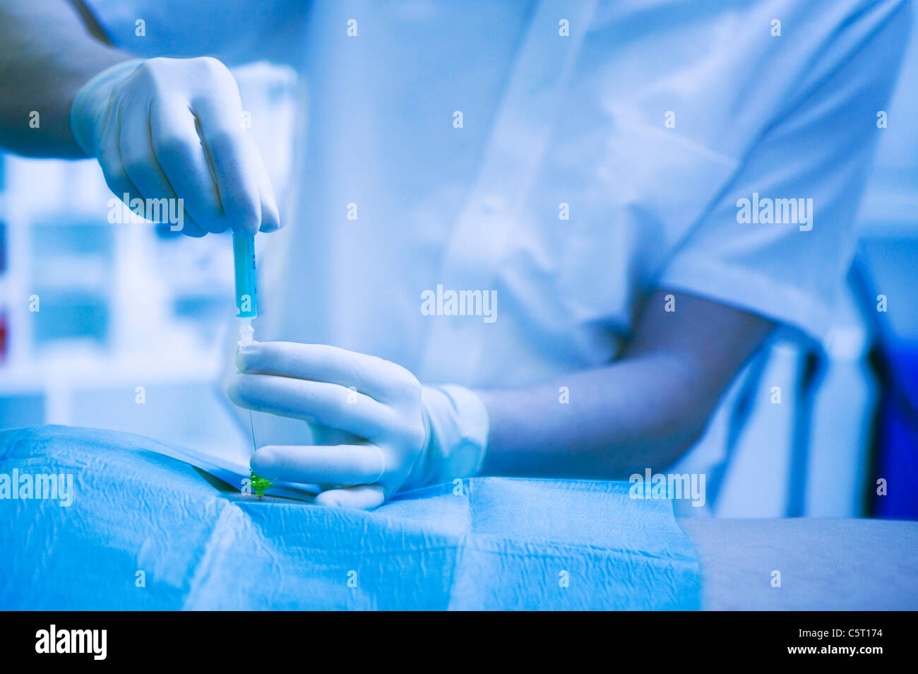 Patient given an injection Stock Photo - Alamy