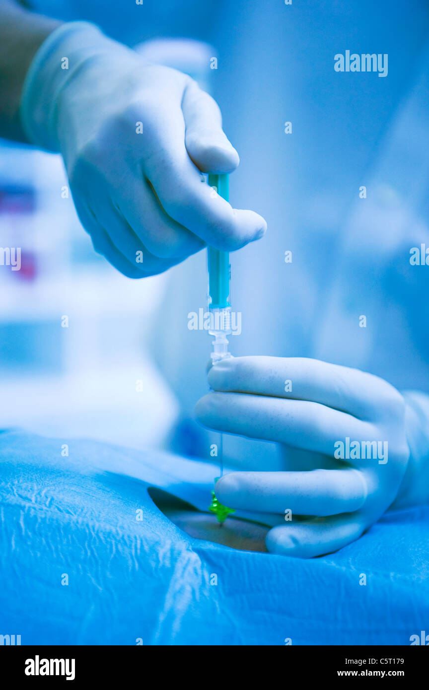 Patient given an injection Stock Photo - Alamy