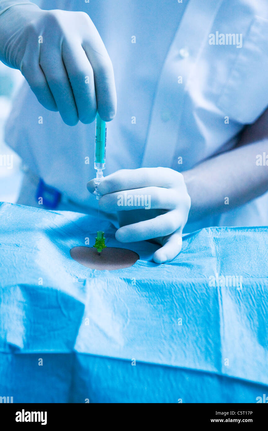 Patient given an injection Stock Photo - Alamy