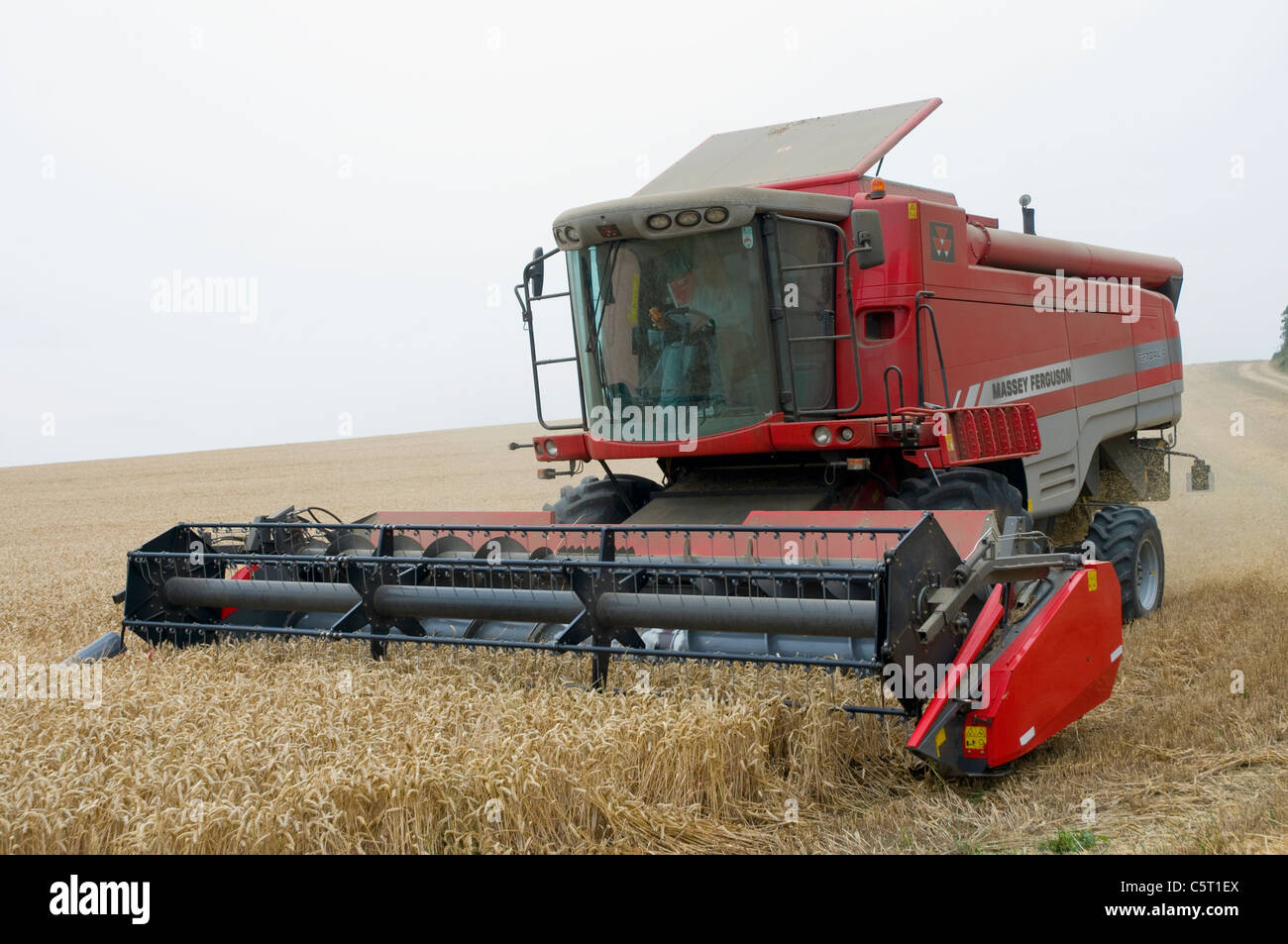 Red combine harvester hi-res stock photography and images - Alamy