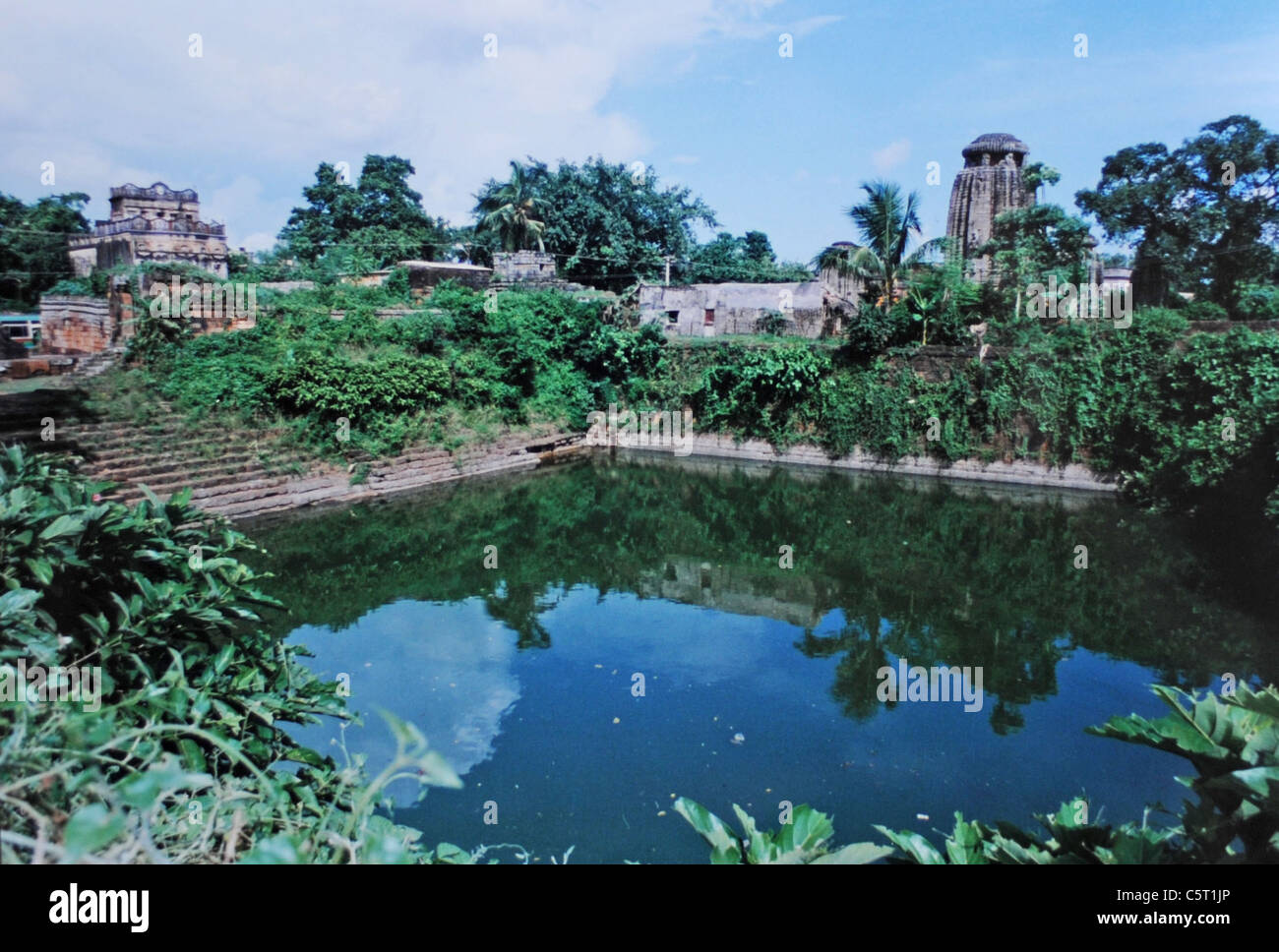 A ghat and temples behind in the city of Bhubaneswar in the Orissa ...