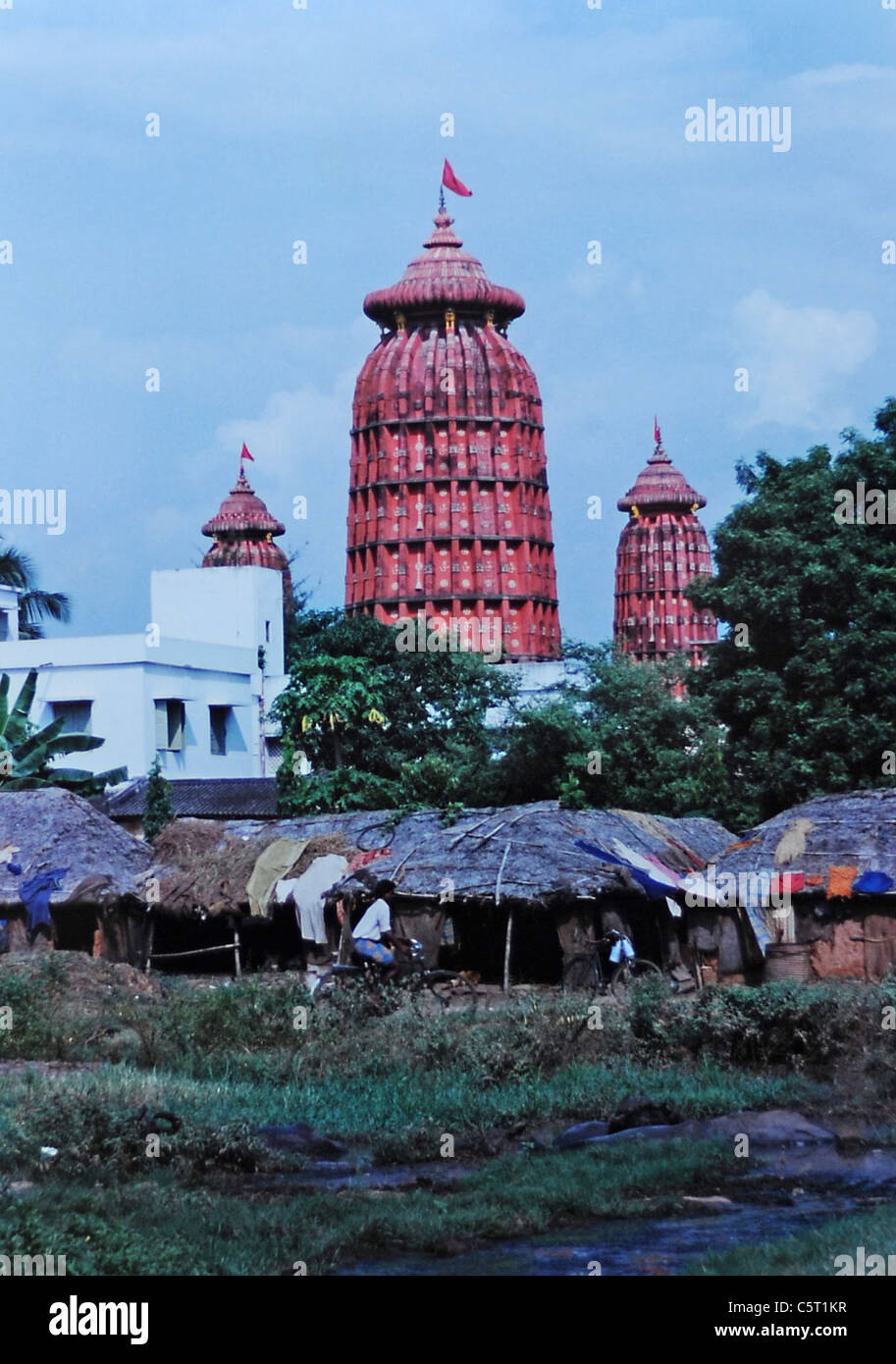 Religious temple rises above poor dwellings of people living in the ...