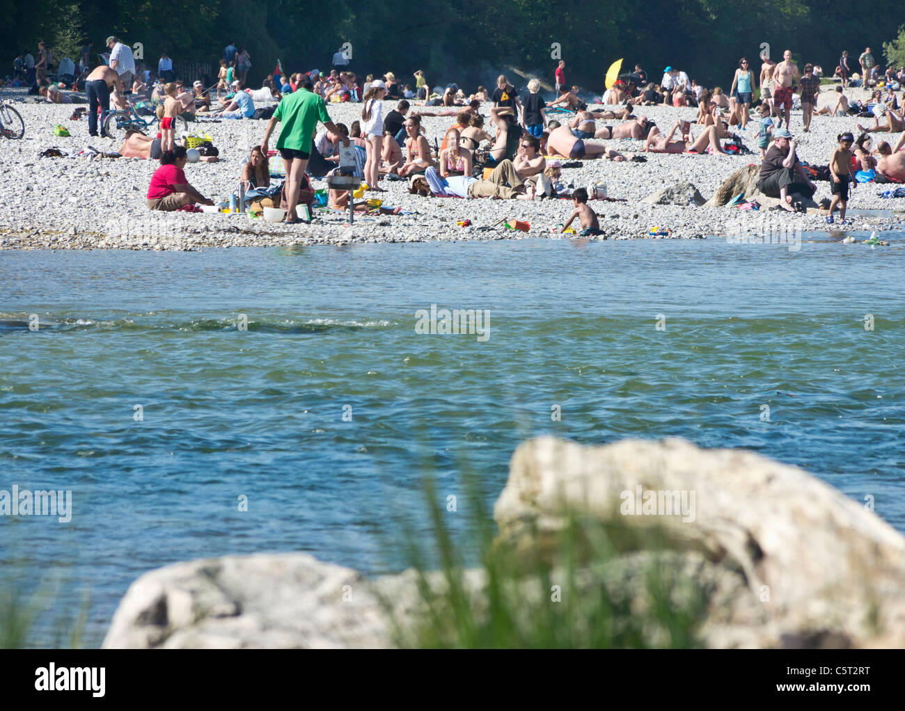 Germany, Bavaria, Munich, View of people at Isar riverbank Stock Photo ...