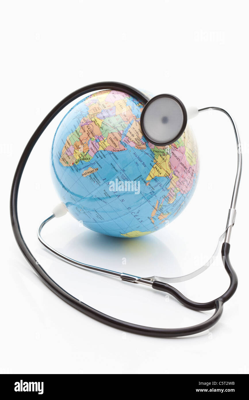 Terrestrial globe with stethoscope on white background Stock Photo - Alamy