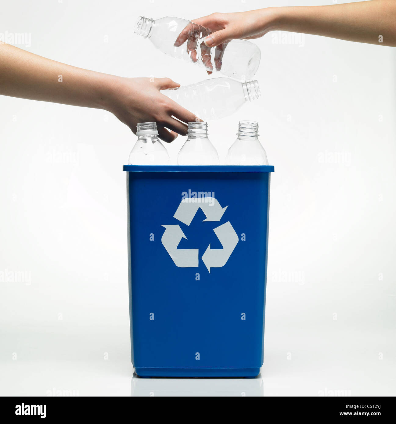 Hands putting plastic bottles inside the recycle bin Stock Photo - Alamy