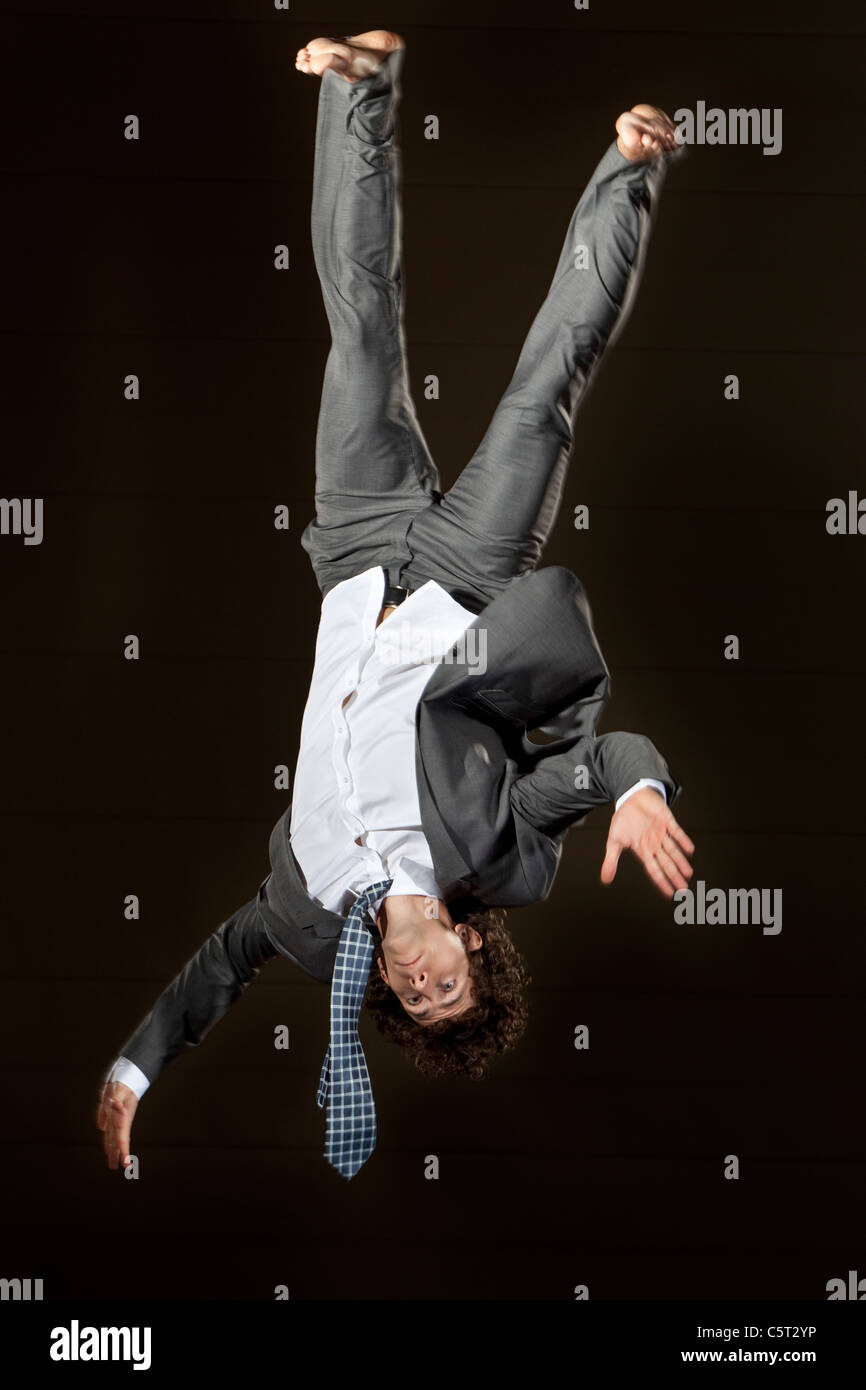 Germany, Bavaria, Businessman in upside down position Stock Photo - Alamy