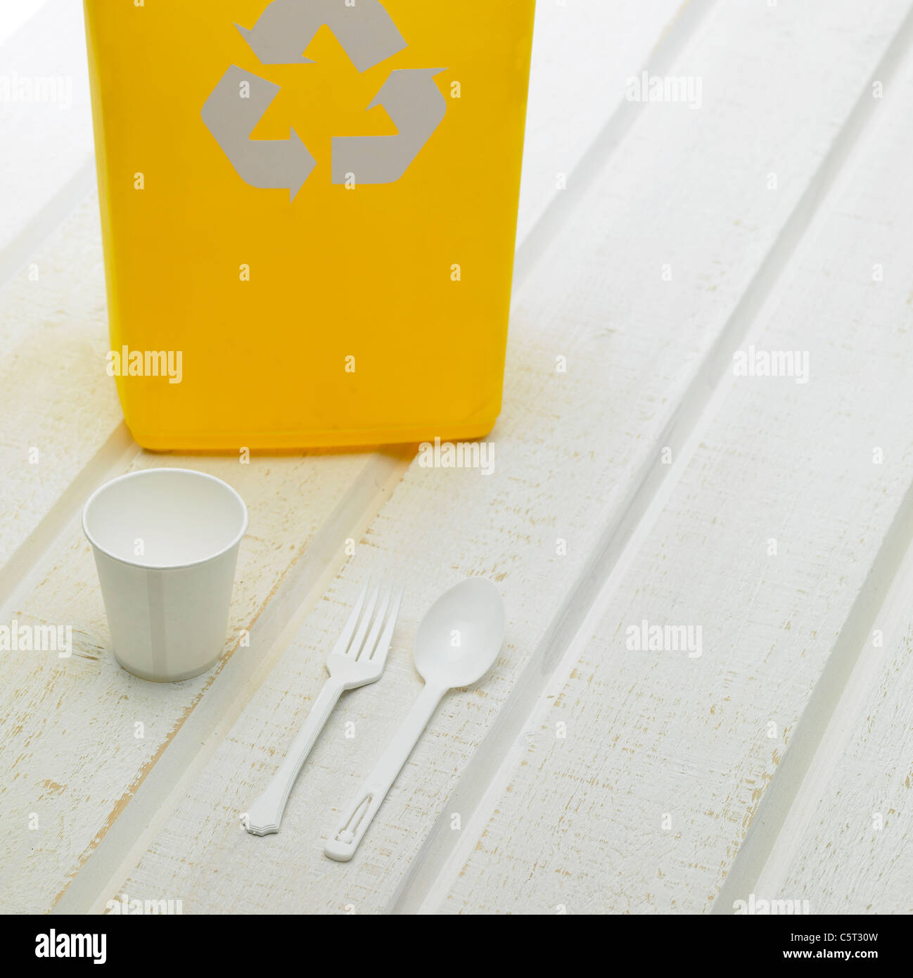Recycling bin and other objects on the floor Stock Photo - Alamy
