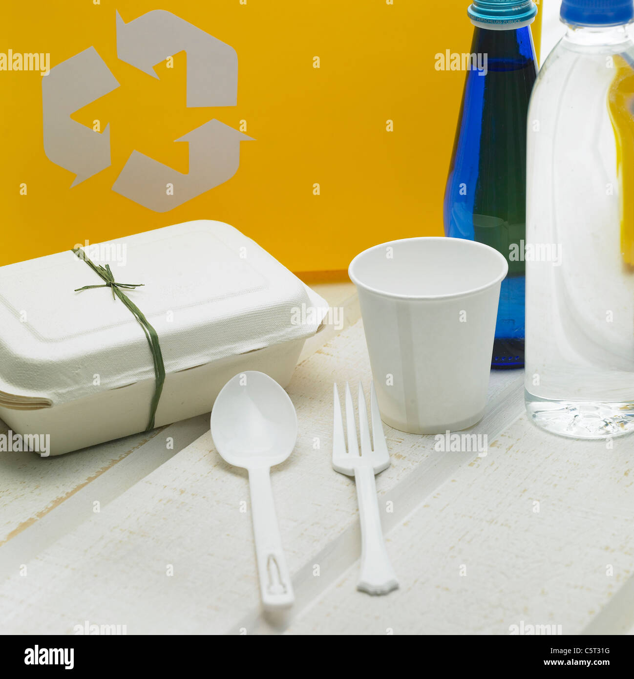 Recycling bin and other objects on the floor Stock Photo - Alamy
