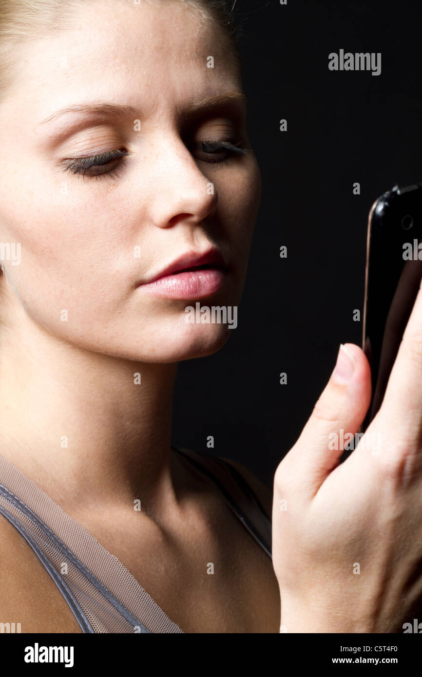 Young woman with mobile phone Stock Photo - Alamy