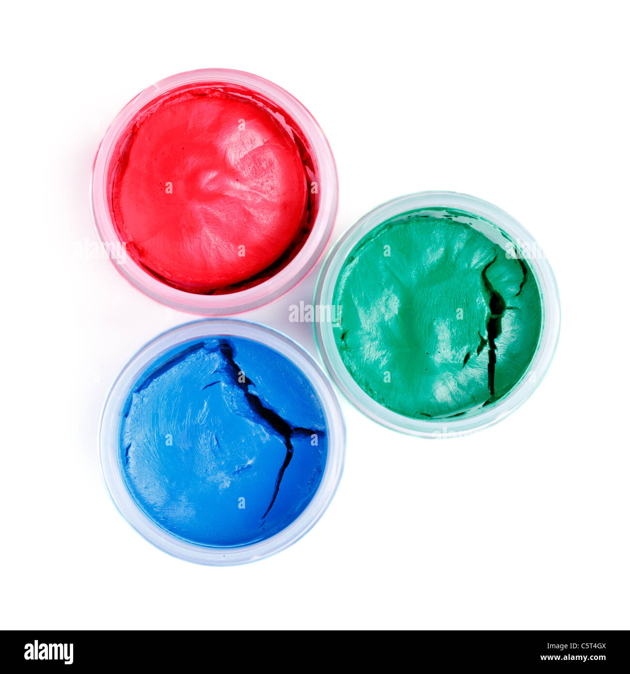 three paint cans isolated on white background Stock Photo - Alamy