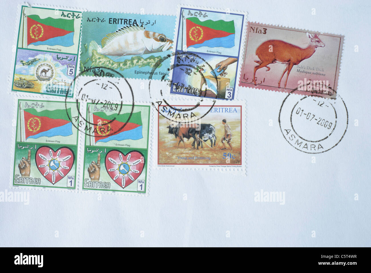 Close up of devaluated stamps against white background Stock Photo - Alamy