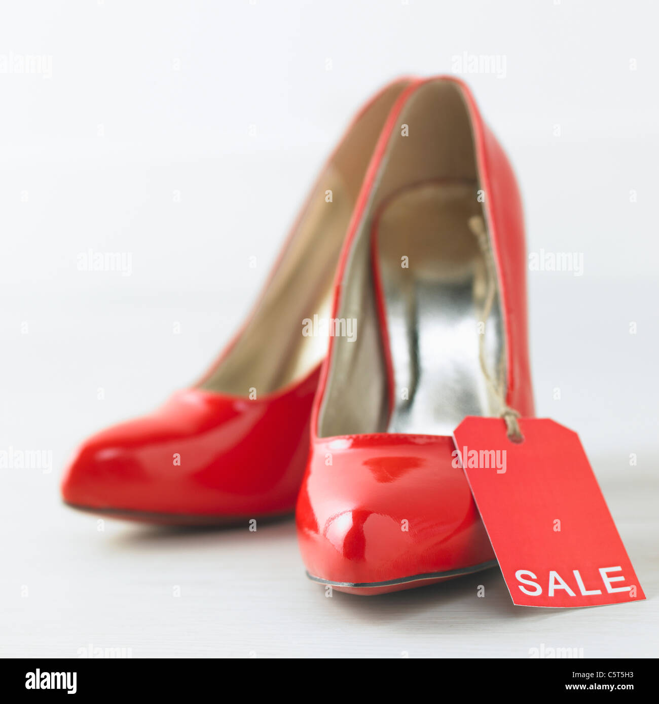 High heels with a tag Stock Photo - Alamy